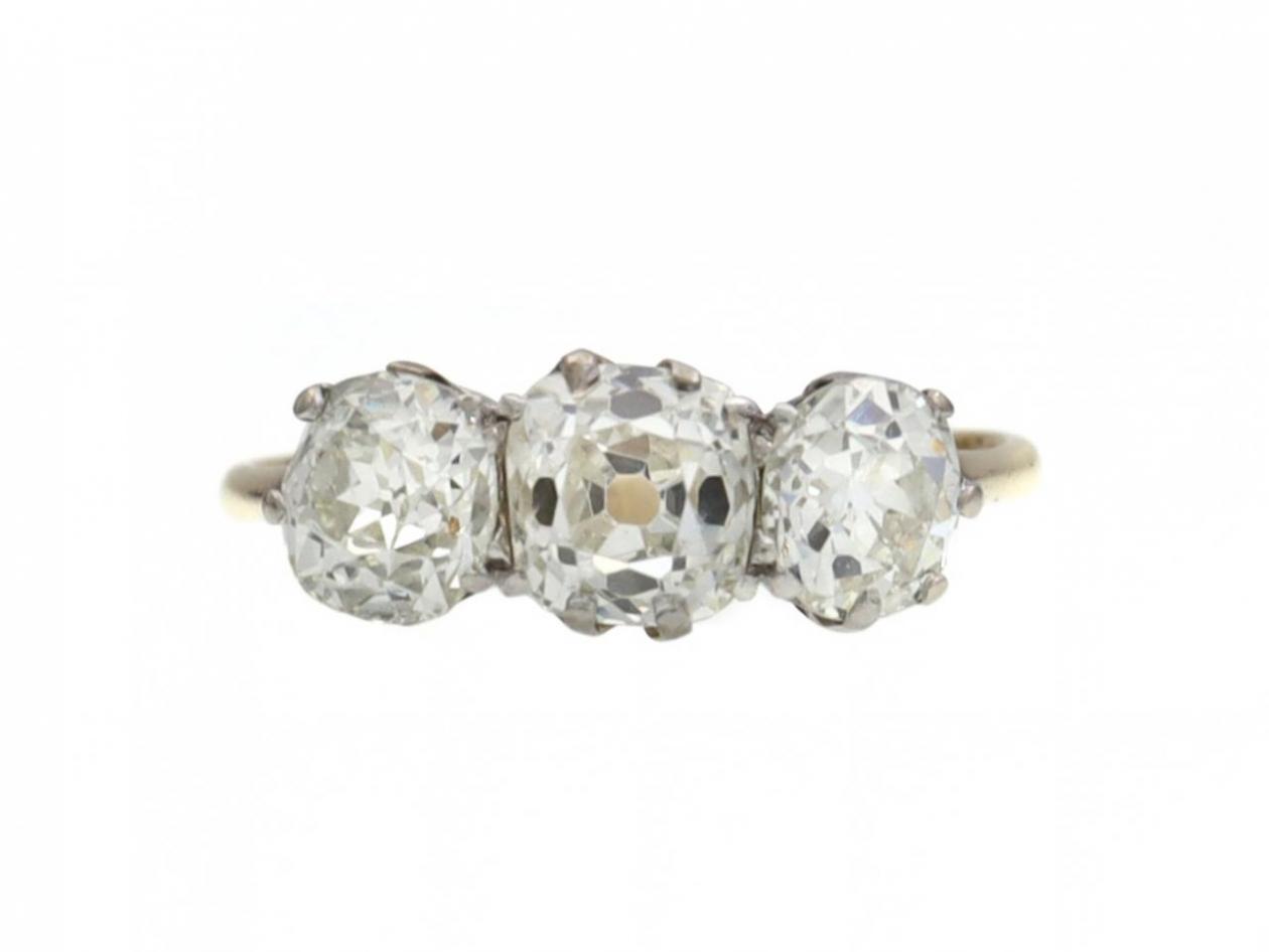 Antique three stone Old Mine cut diamond engagement ring